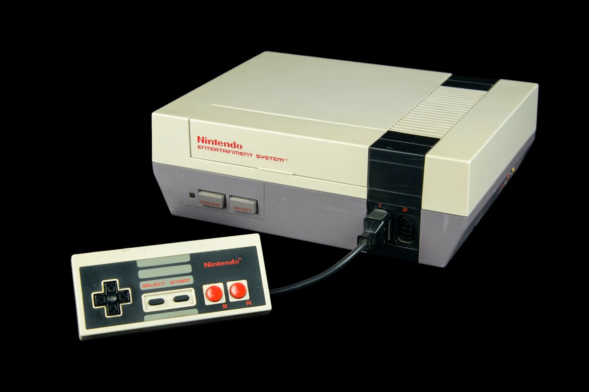Nintendo Entertainment Sytem (NES) console with two controllers ...