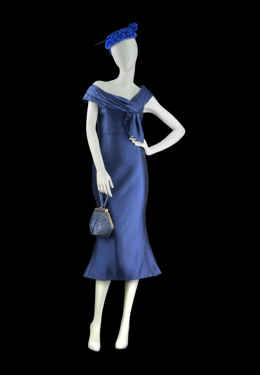Midnight blue silk evening dress and royal blue flower hat worn by ...